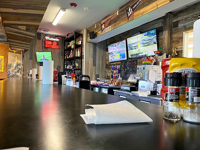The counter view—where decisions are made, orders are called, and the choreography of comfort food unfolds before your eyes.