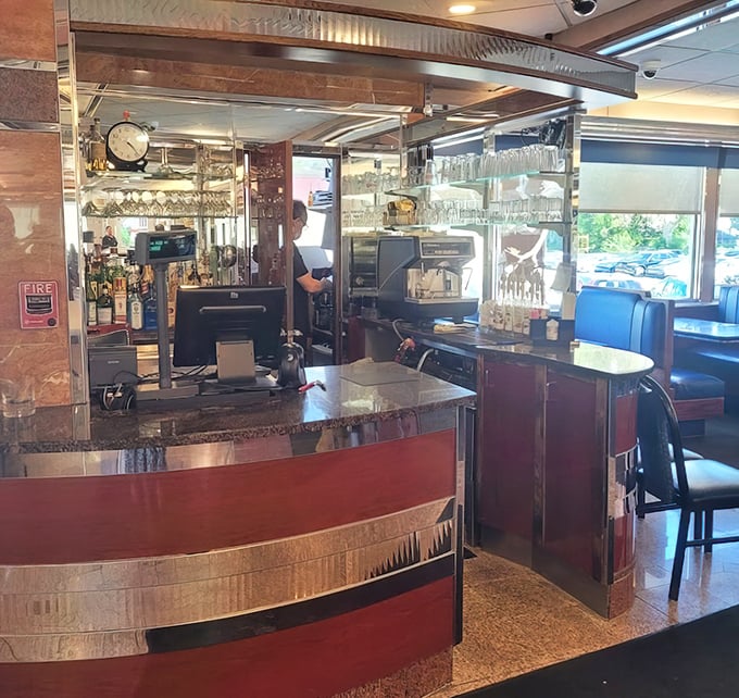The beating heart of any great diner—a counter where solo diners find company and the coffee is always just a glance away.