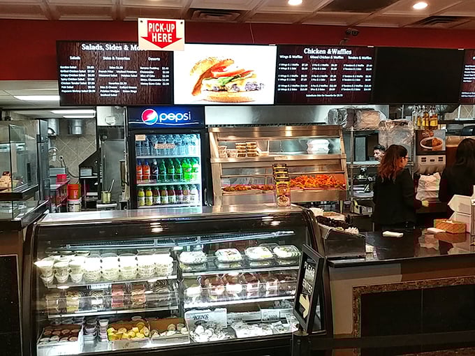 Behind this counter, culinary magic happens daily. Like watching artists at work, except you get to eat the masterpiece.