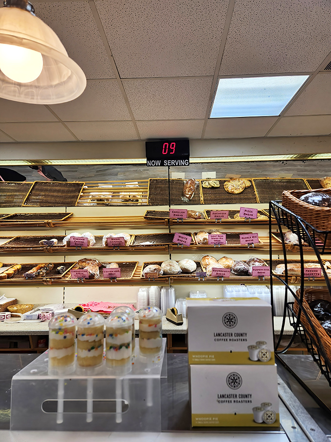 Bakery perfection has a number—it's customer #9, and they're about to experience bread nirvana at this well-organized counter.