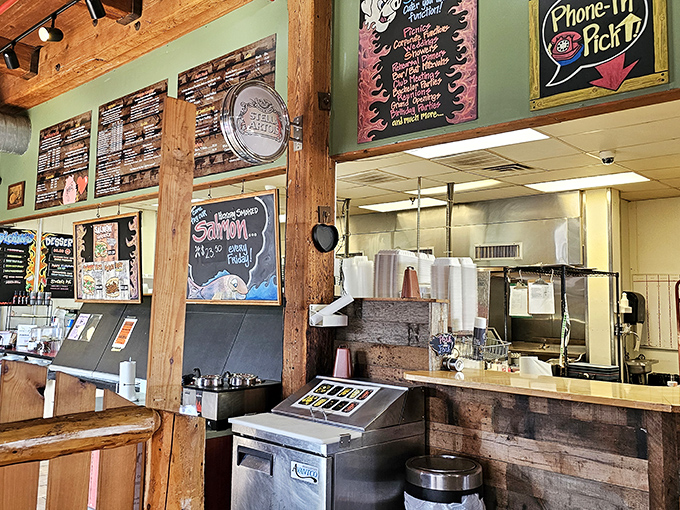 The ordering counter—where dreams are made and diets go to die, all beneath hand-written menu boards that promise smoky salvation.