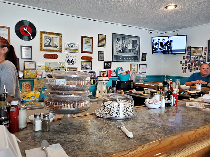 The counter is where the magic happens – part stage, part community table, where the pie display works better than any dating app.