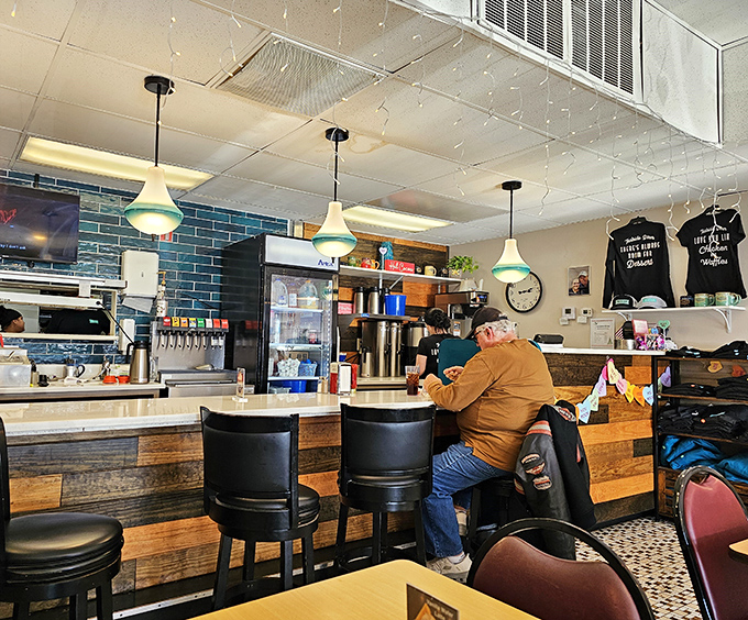 The counter—where solo diners find community and coffee refills appear like magic. Front-row seats to the breakfast show.