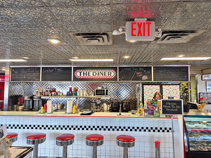 The counter—where solo diners find community, regulars claim their territory, and everyone gets a front-row seat to the short-order ballet.