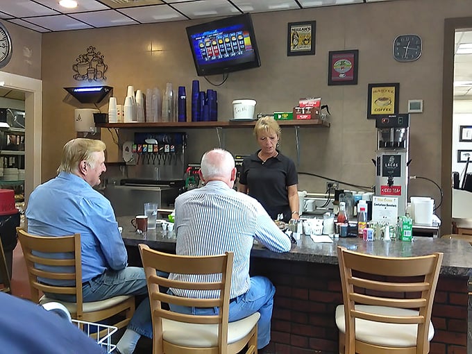 The counter seats—where solo diners become part of the restaurant family and regulars exchange local wisdom between coffee refills.