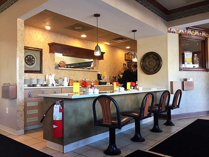 The counter seats—breakfast's front-row tickets—where solo diners can watch the morning ballet of spatulas and coffee pours while contemplating life's important questions.