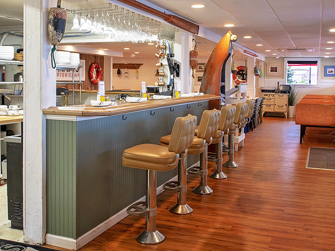 Counter seating that invites you to belly up for a front-row view of coastal cuisine—where every stool tells a story of satisfied diners past.