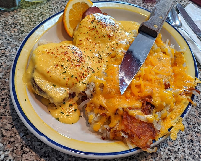 Eggs Benedict gets the country treatment with cheese-topped potatoes that could make a cardiologist weep with both fear and longing.