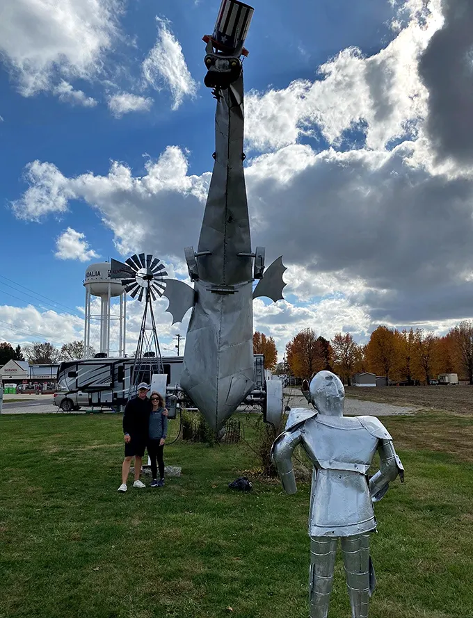 Happy travelers pose with their new favorite roadside discovery, proving that the best adventures happen off the beaten path.