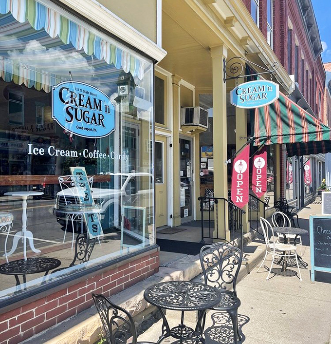 Cream 'n Sugar Café's sidewalk seating beckons you to slow down, savor something sweet, and remember what conversations were like before texting.