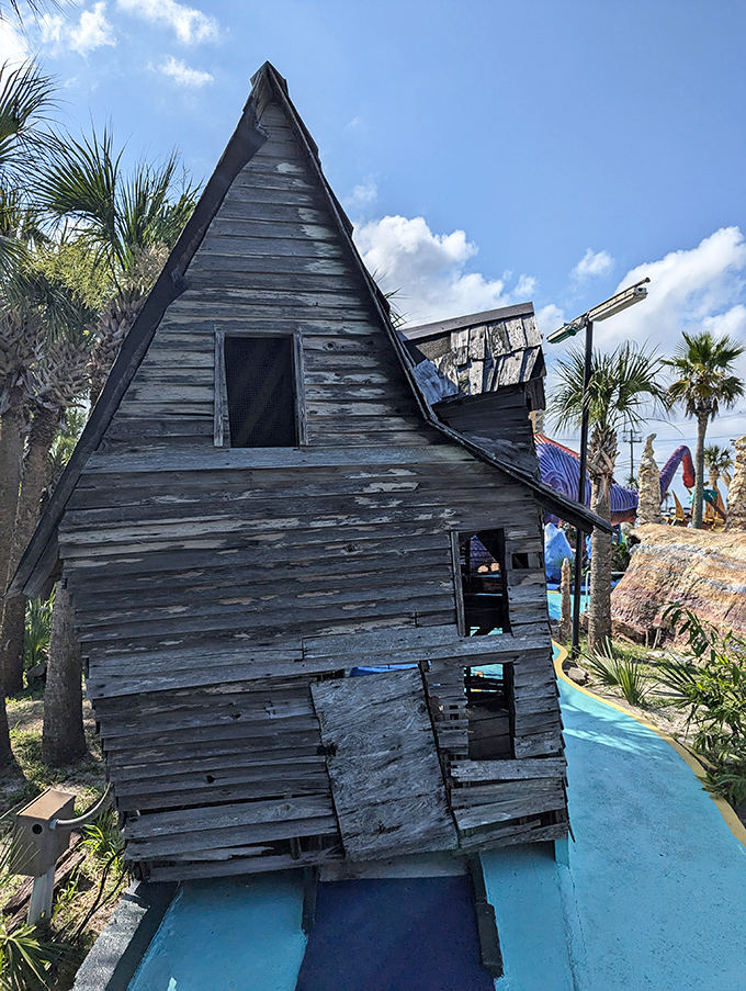 The crooked house looks like it survived a cartoon hurricane, adding architectural impossibility to your already challenging putt.