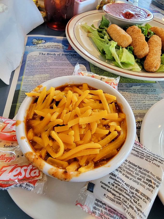 A bowl of chili topped with enough cheese to make Wisconsin nervous. The perfect companion for those days when soup seems too formal.