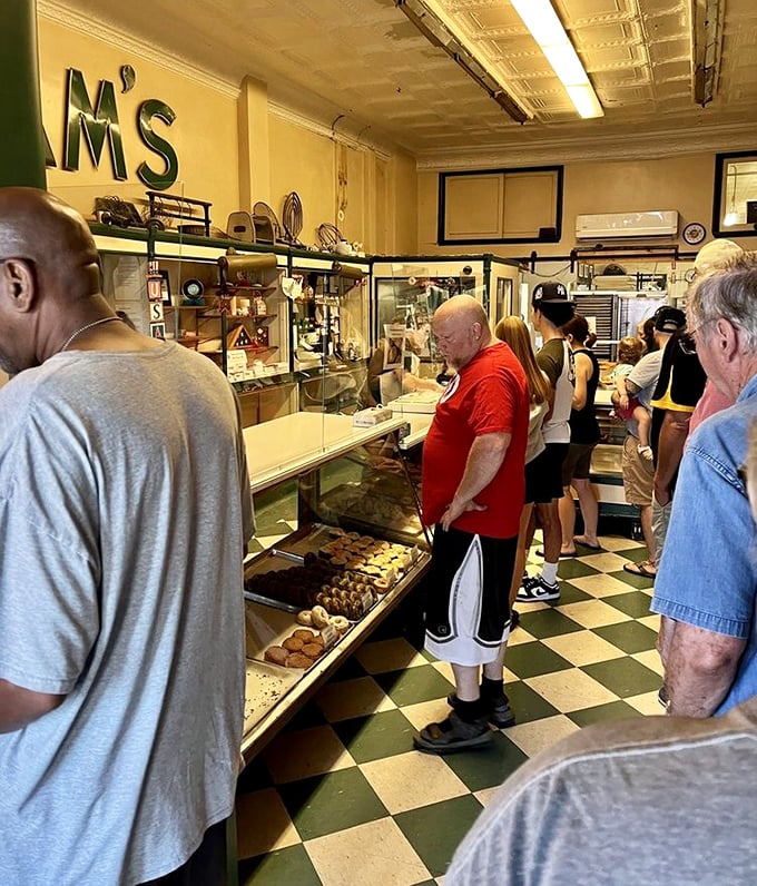 The line forms early and with purpose—these customers aren't just buying donuts, they're participating in a delicious ritual that transcends generations. 