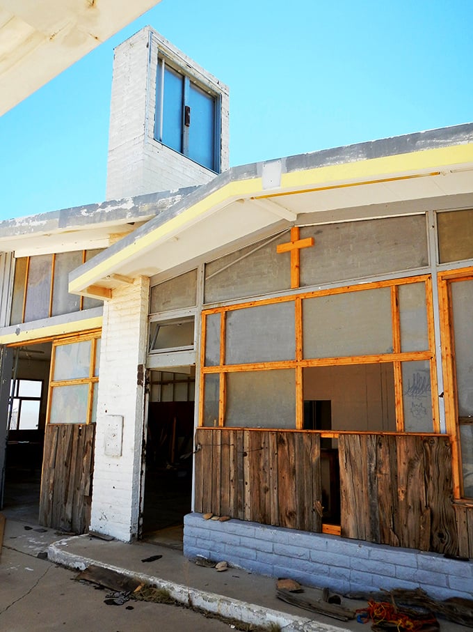 Abandoned buildings become accidental art installations when the desert decides to curate the perfect decay display.