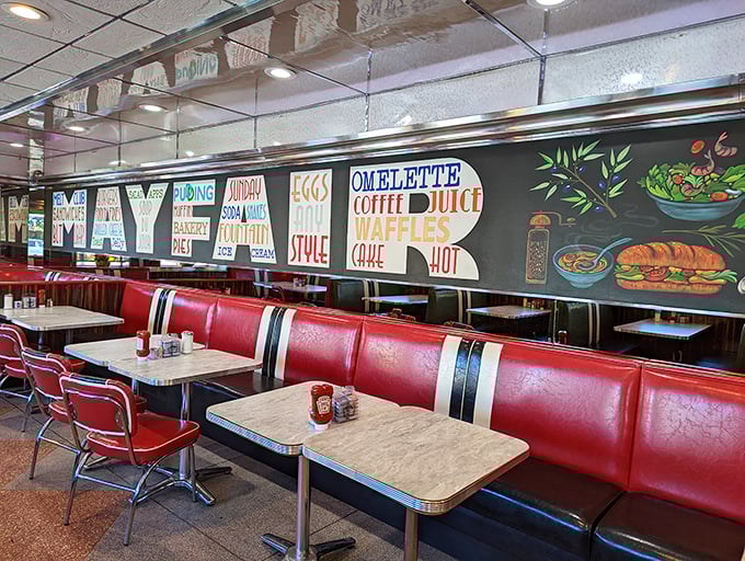 Red booths line the wall beneath hand-painted signs that spell out the Mayfair's philosophy: good food served with a side of nostalgia.