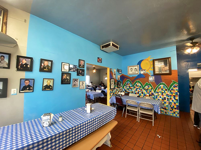 Blue walls adorned with family photos create the feeling you're eating in someone's home—which is exactly the point.