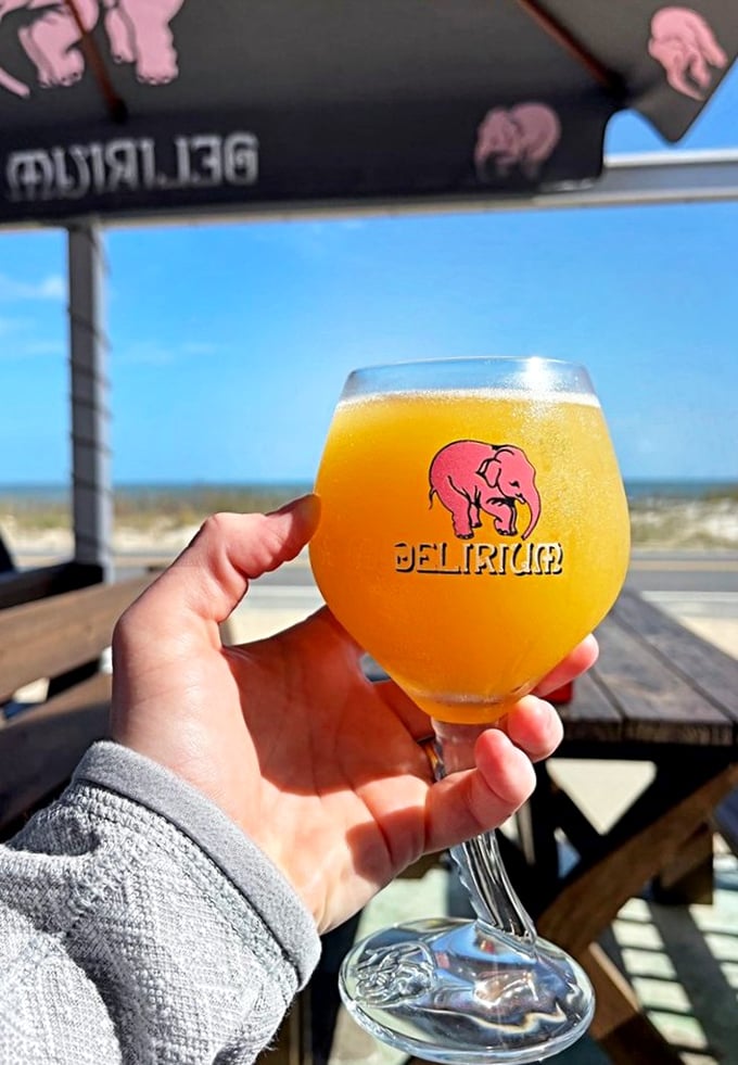 A golden glass of happiness with an ocean view. This beer isn't just cold—it's "forget your problems for the afternoon" cold.