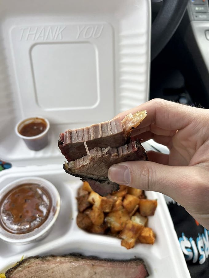 Behold the pink smoke ring—nature's way of telling you this brisket has been loved, pampered, and perfectly smoked.