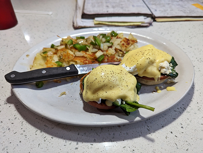 Eggs Benedict that would make the Pope himself convert to the Church of Hollandaise. Those home fries aren't looking shabby either.