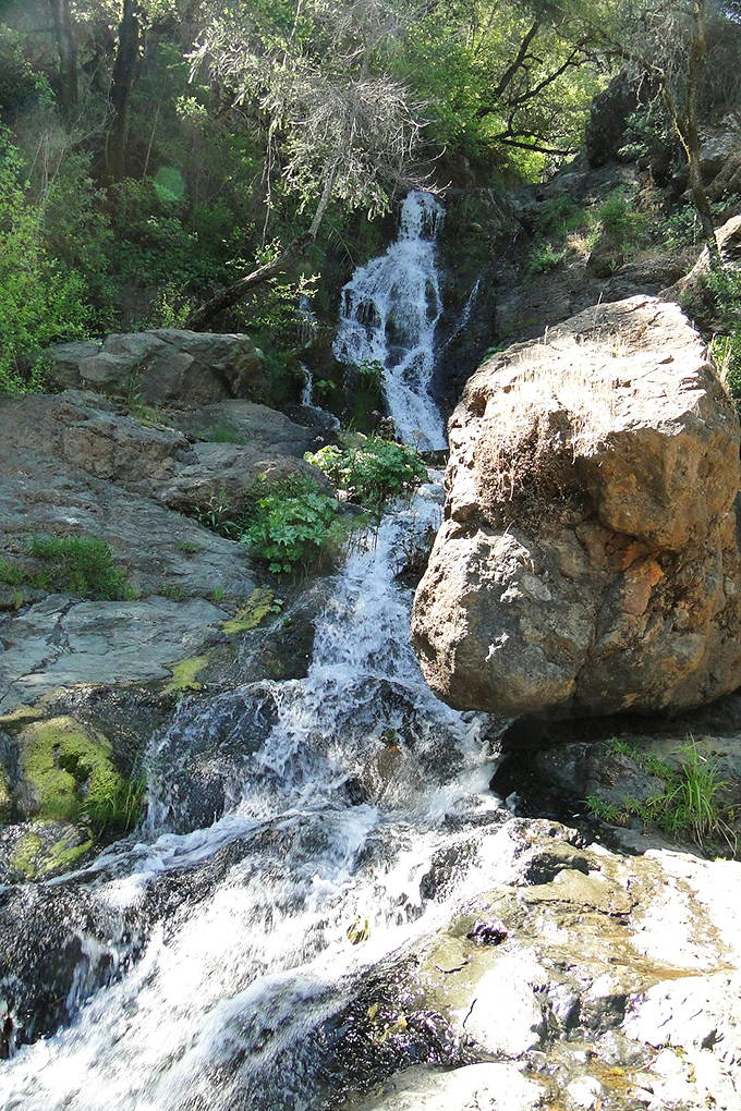 This cascade isn't just a waterfall—it's nature's champagne, bubbling over ancient rocks in celebratory fashion.