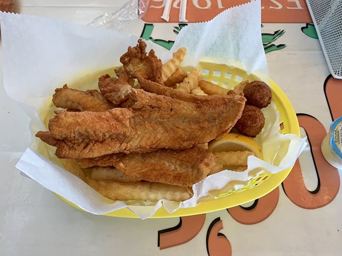 Fish so fresh it practically jumps onto your plate. Golden fillets nestled alongside fries – simple perfection that needs no elaborate explanation.