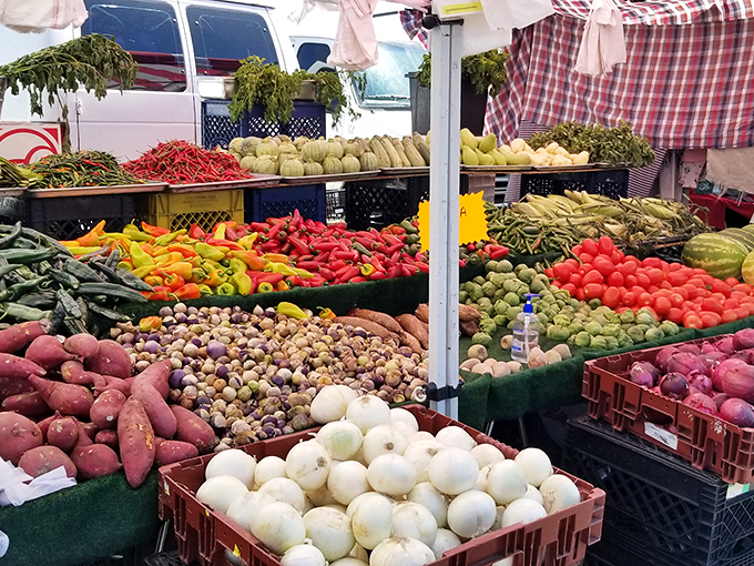 Fresh produce bursts with color, proving that even flea markets know how to keep things healthy. 