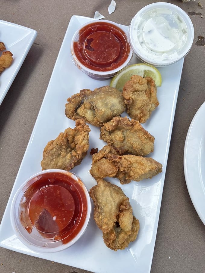 These aren't just fried oysters—they're crispy-coated treasures from the Chesapeake, each one a perfect two-bite adventure.
