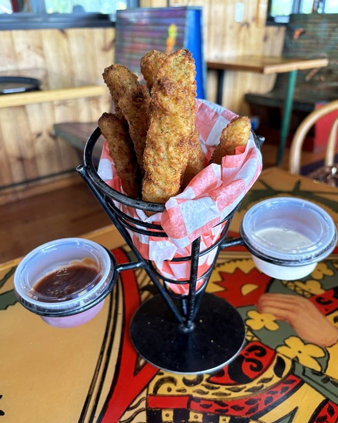 Pickle Bill's famous fried pickles arrive like golden treasure sticks, ready to be dunked in their accompanying flavor potions.