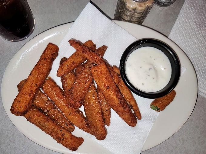 Golden-fried zucchini sticks with ranch dressing—proof that vegetables can be both virtuous and deliciously sinful at the same time.