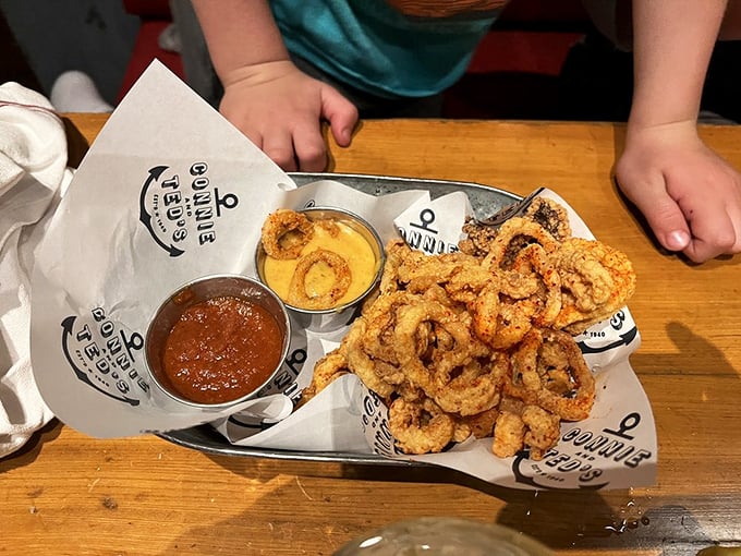 Fried calamari that defies the rubbery reputation—golden, crispy rings with dipping sauces worth fighting over.