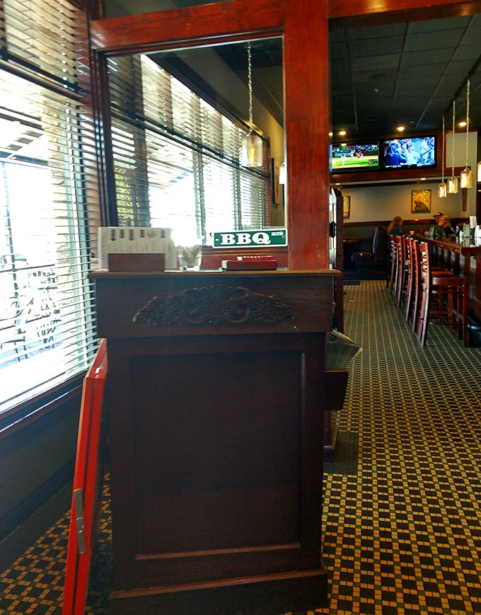 The hostess station—that magical gateway between your hungry arrival and your imminent meat-induced happiness. The BBQ sign knows what's up.
