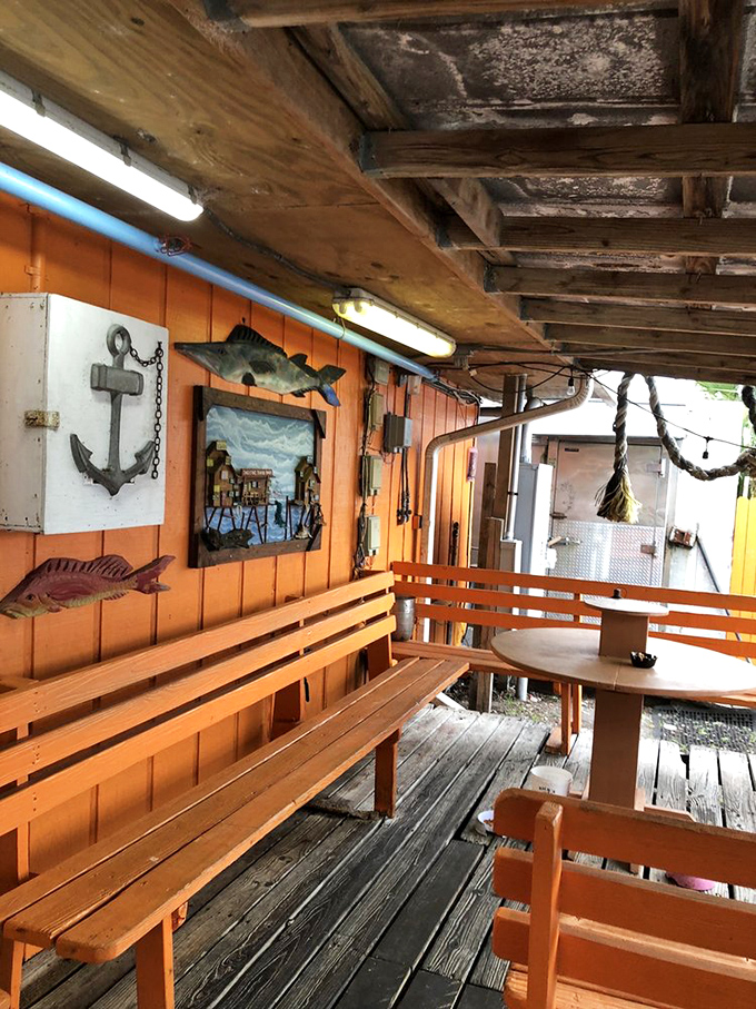 Nautical décor that wasn't purchased from a catalog but accumulated through decades of authentic coastal living. That anchor isn't ironic – it's earned.