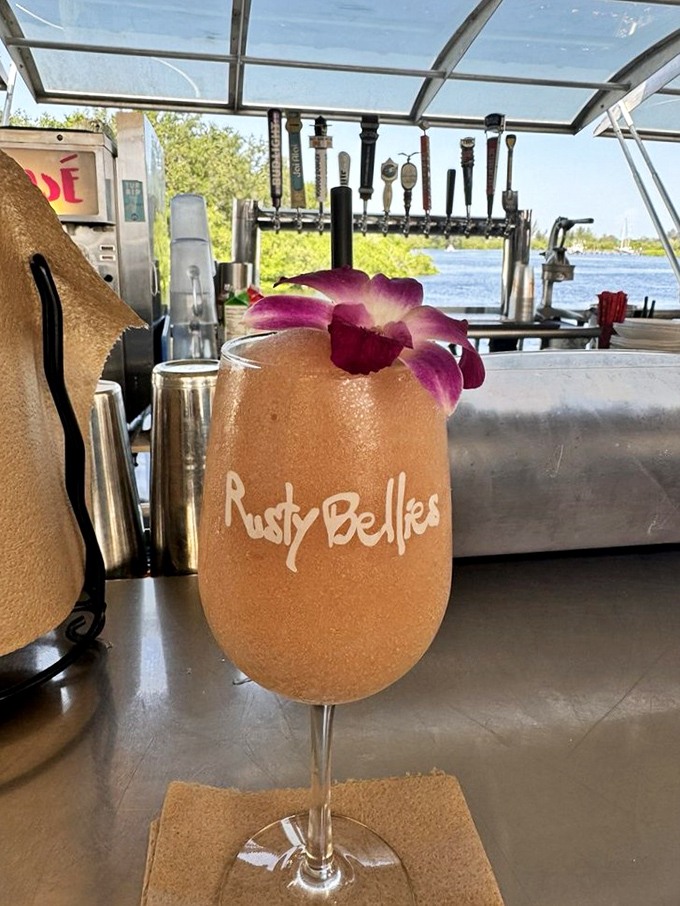 Florida in a glass—a frosty, tropical concoction garnished with an orchid that says "vacation" even if you're just on lunch break.