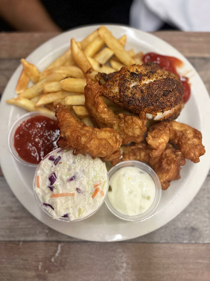 A platter that can't decide between fried grouper, shrimp, or both—so you get the pleasure of not choosing. The coleslaw looks particularly smug.