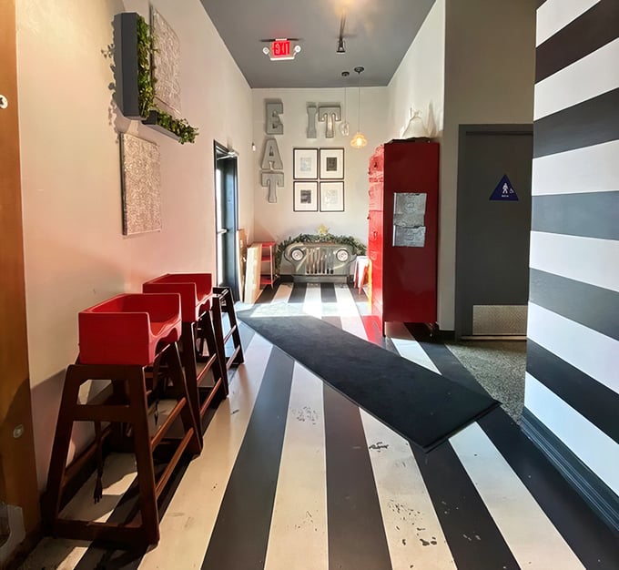 Even the hallway tells a story with its bold stripes and playful "EAT" signage—a reminder of why you came in the first place.