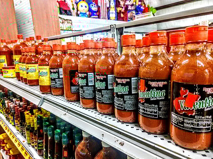 Hot sauce bottles stand in formation like spicy soldiers, their fiery contents promising to transform any bland meal into a flavor adventure.