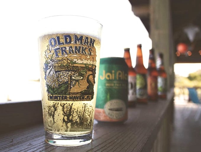 Cold beer in a branded glass with water views—basically the Florida equivalent of winning the relaxation lottery.