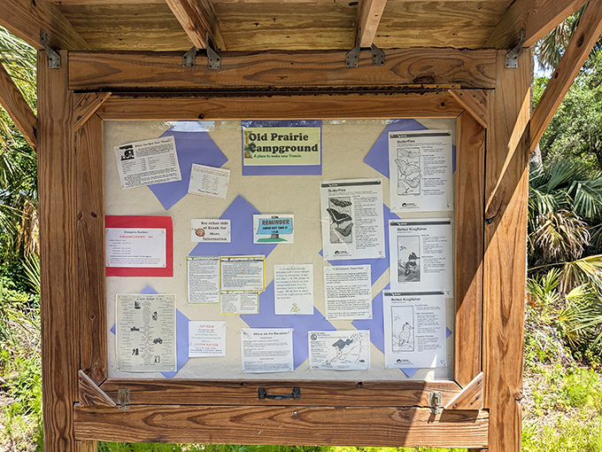 The information board—where "Old Prairie Campground" isn't just a place, but an invitation to disconnect from everything modern.