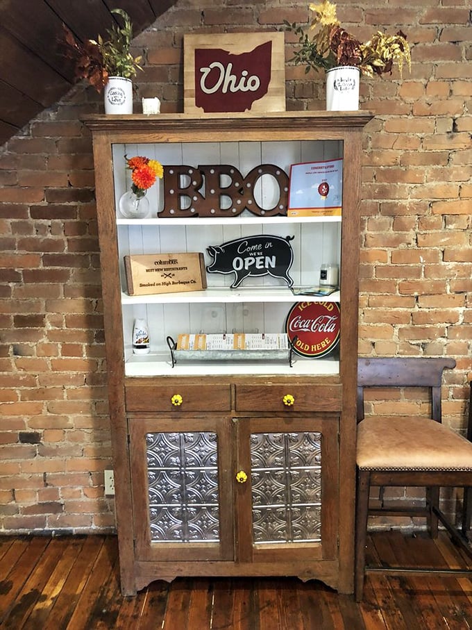 That Ohio sign and BBQ display cabinet say it all—state pride meets smoke pride in this cozy corner.