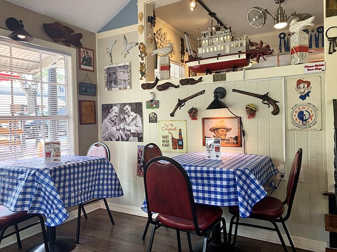 Blue checkered tablecloths and walls adorned with nautical treasures – like dining in the cozy galley of a ship captained by your favorite aunt.
