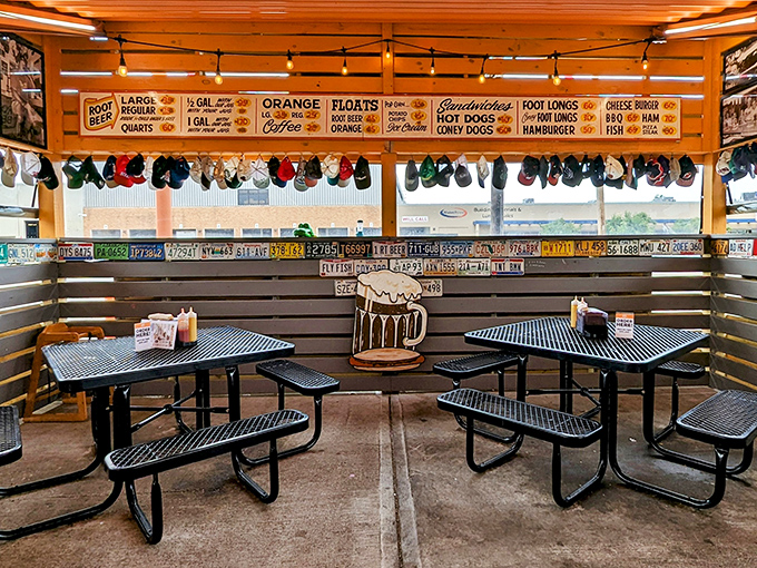 Baseball caps hang like colorful stalactites from the ceiling while vintage menu boards remind us of simpler pricing times. Nostalgia you can eat in.