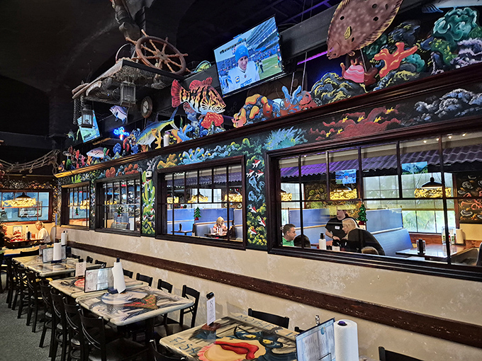 The nautical-themed dividers aren't just decorative—they're portals to different oceanic worlds within this seafood sanctuary.