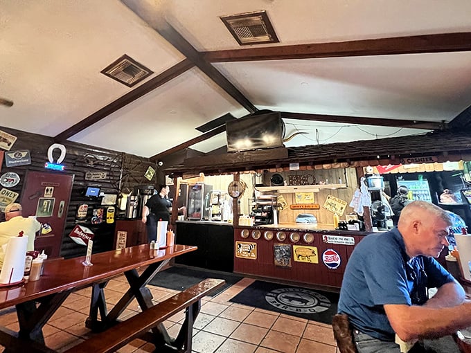 The dining room feels like your favorite uncle's cabin—if your uncle happened to be a barbecue genius with a penchant for picnic tables.