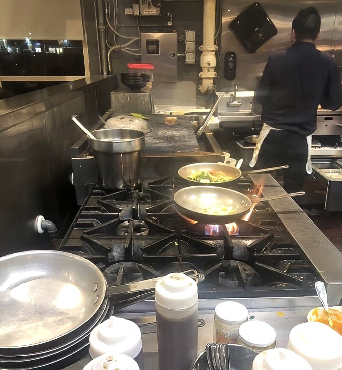 Where the magic happens—no smoke, mirrors, or microwaves. Just skilled hands transforming the morning's catch into the evening's memories.