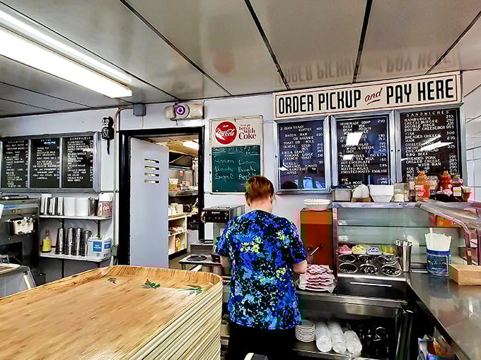 Where "ORDER PICKUP and PAY HERE" isn't just a sign—it's the beginning of a beautiful friendship between you and your soon-to-be meal.