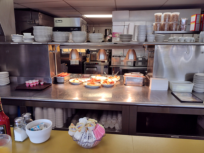 The kitchen pass—where dreams become reality. Like peeking behind the curtain at the culinary equivalent of Oz, minus the smoke and mirrors.