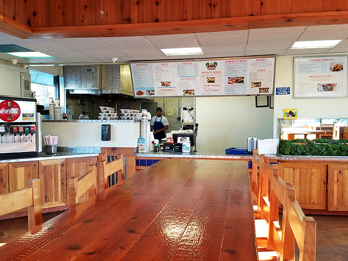 Where the magic happens—a glimpse into the kitchen where tortillas meet their destiny and hungry customers place their orders with anticipation.