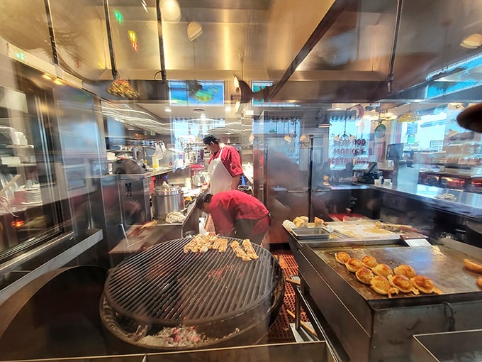 Where the magic happens—mesquite grills firing away as cooks orchestrate your seafood feast behind glass, like a delicious aquarium in reverse.