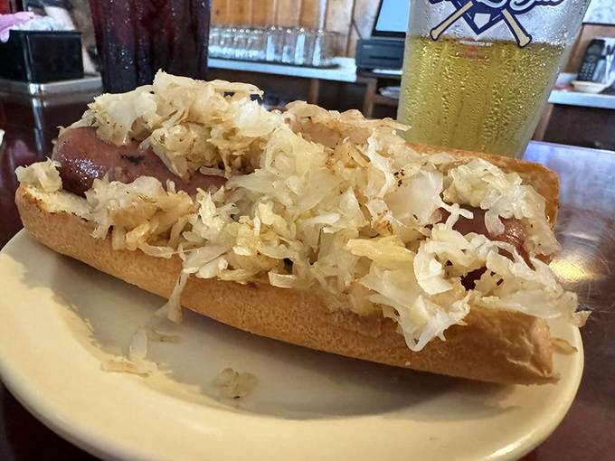 The kraut dog—where German tradition meets American ballpark classic. That pile of sauerkraut adds the perfect tangy crunch to each bite.
