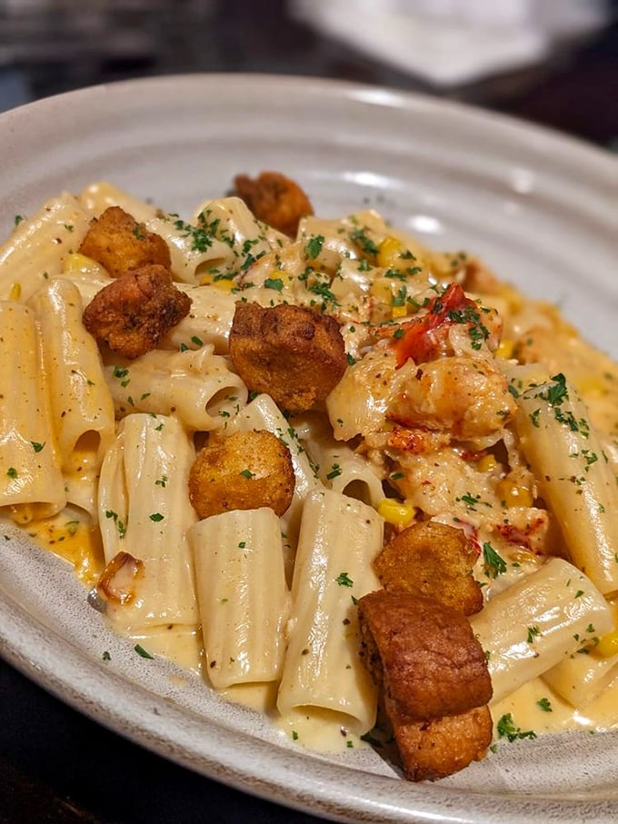 Lobster mac and cheese: where comfort food puts on its fancy pants. Those golden-fried bites on top are the culinary equivalent of a chef's mic drop.